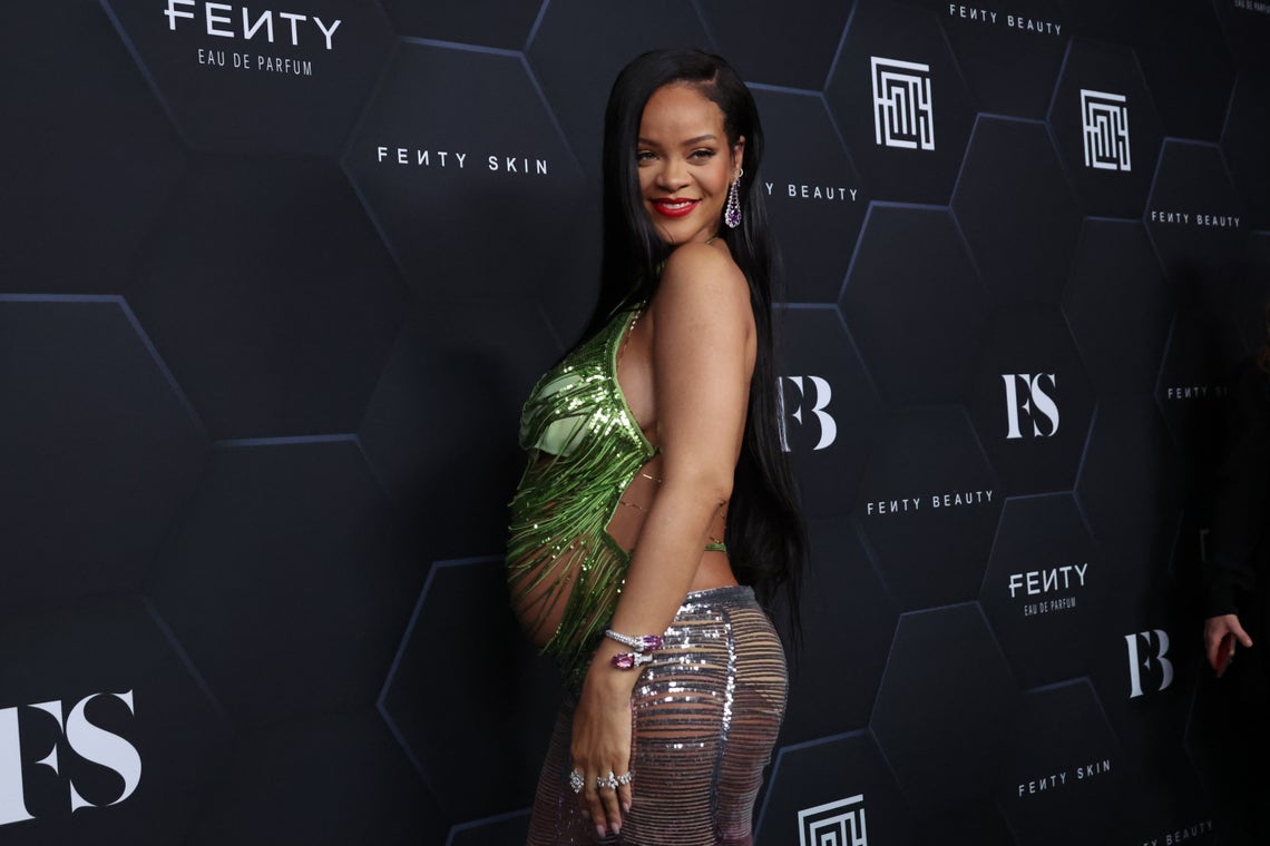 Pregnant Rihanna Cradles Her Baby Bump, Is Joined By A$AP Rocky At Fenty Beauty Event
